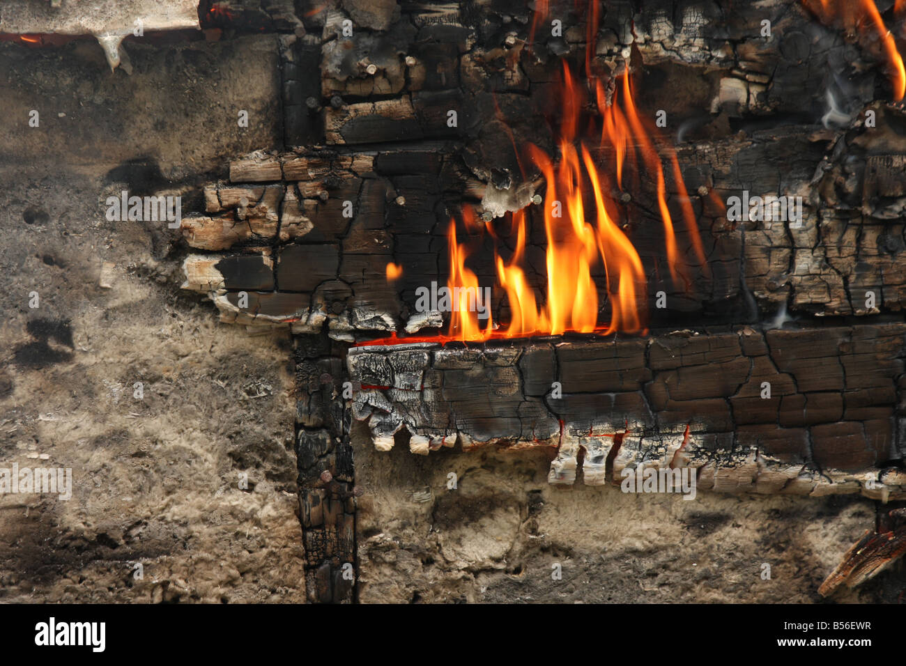 An exterior wall of a house on fire Stock Photo - Alamy
