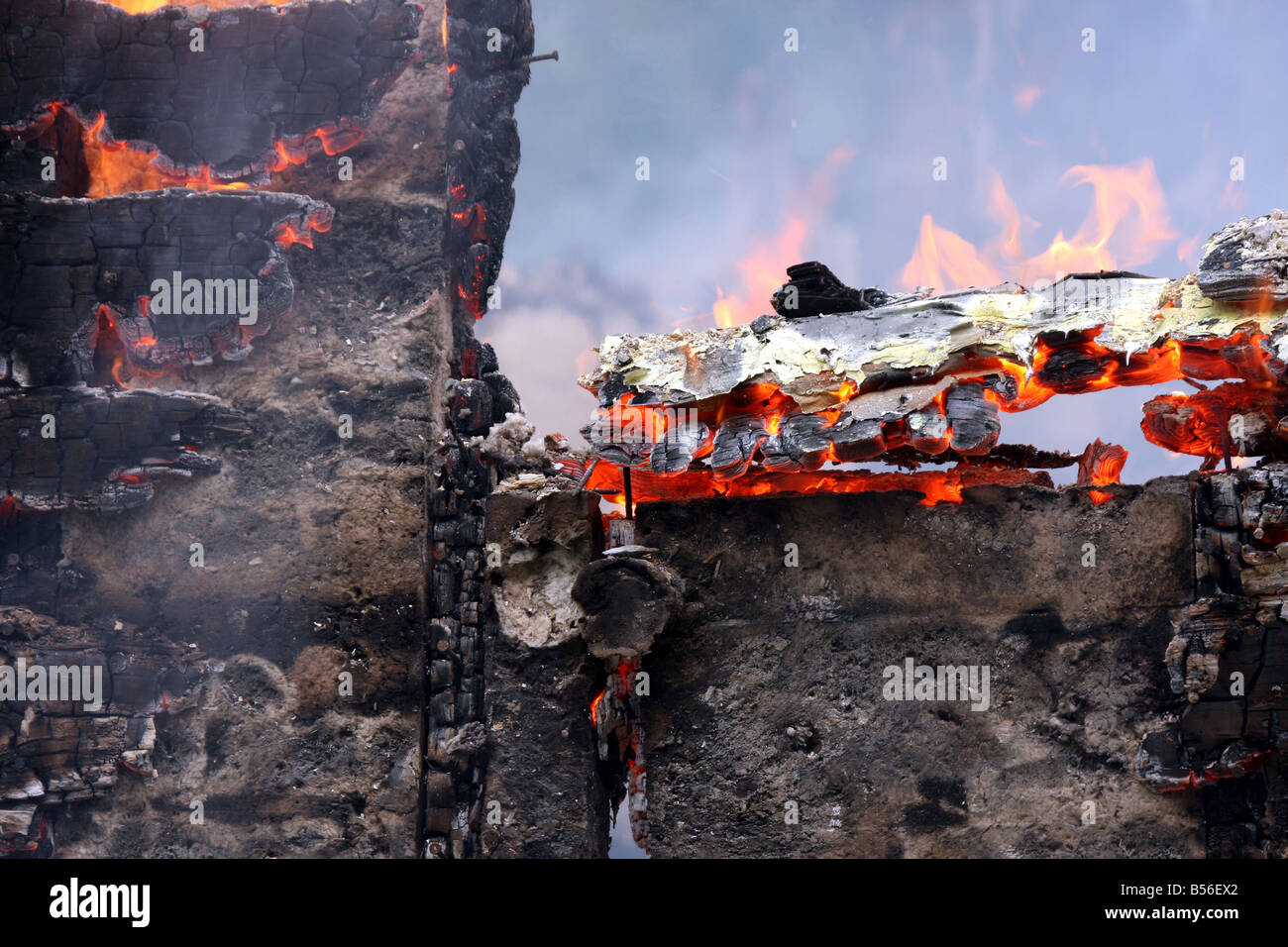 The burning exterior wall of a house on fire Stock Photo - Alamy