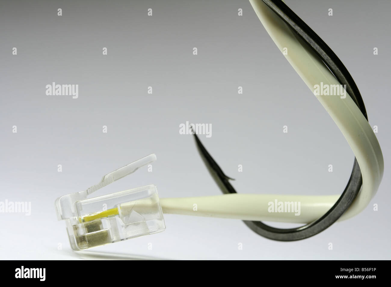 Allegory of Internet dependent: Internet cable for modem and fish hook ...