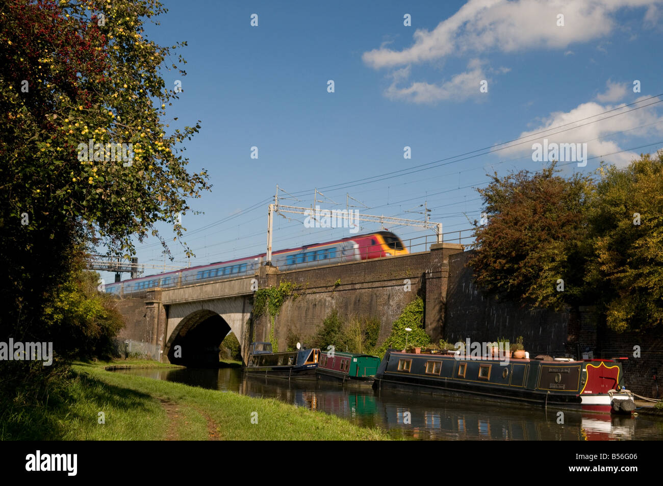 Intercity train flies over a canal bridge Stock Photo - Alamy