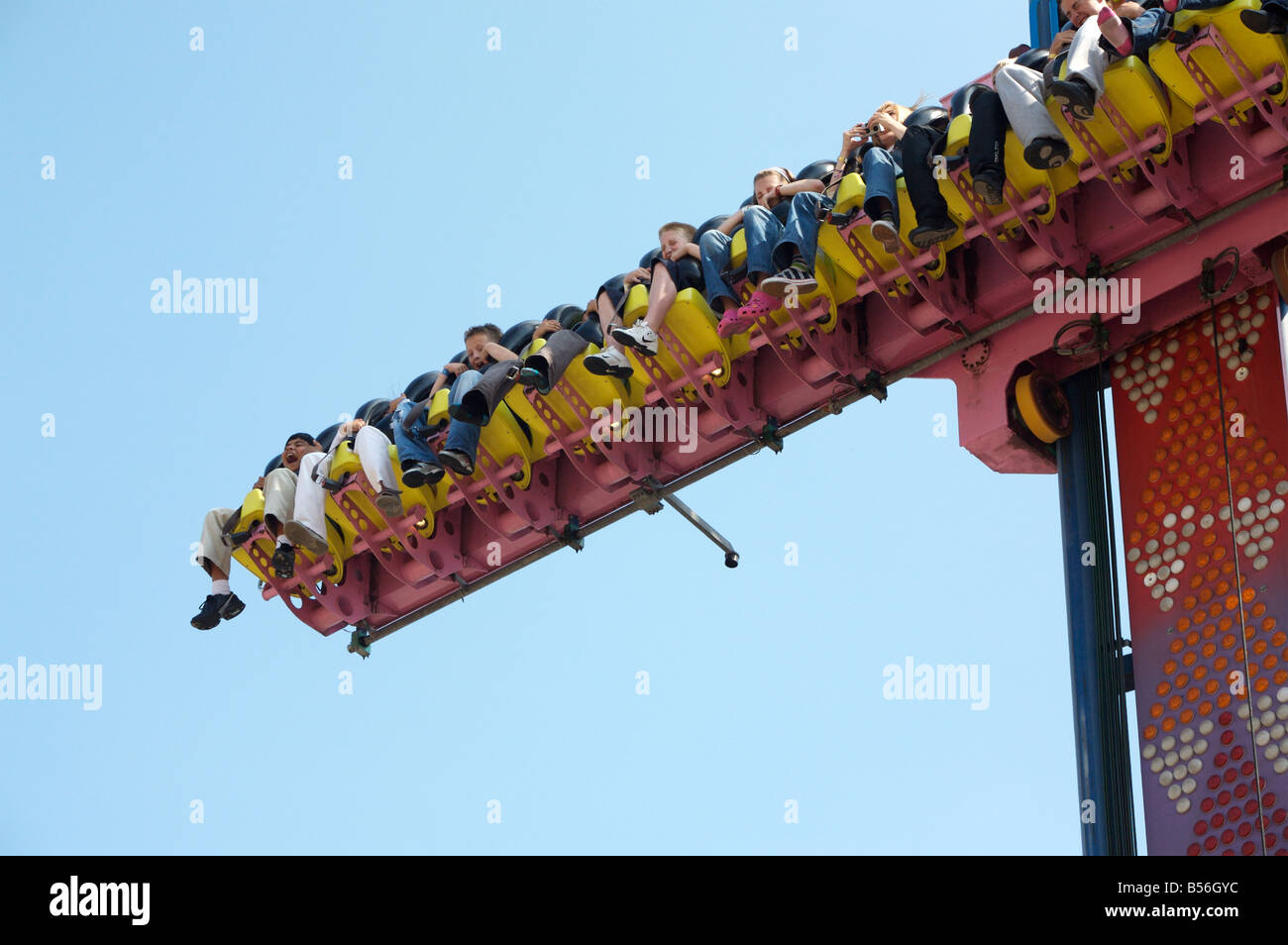 Childrens legs dangling from a ride at an amusement park Stock Photo ...