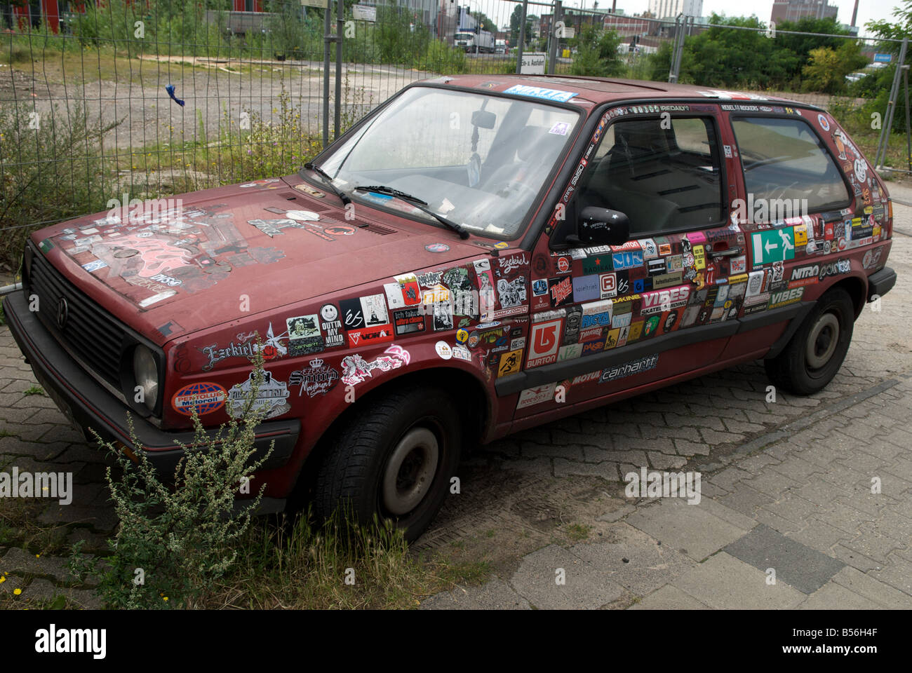 Dumped car on waste ground, Dusseldorf North Rhine-Westphalia, Germany ...