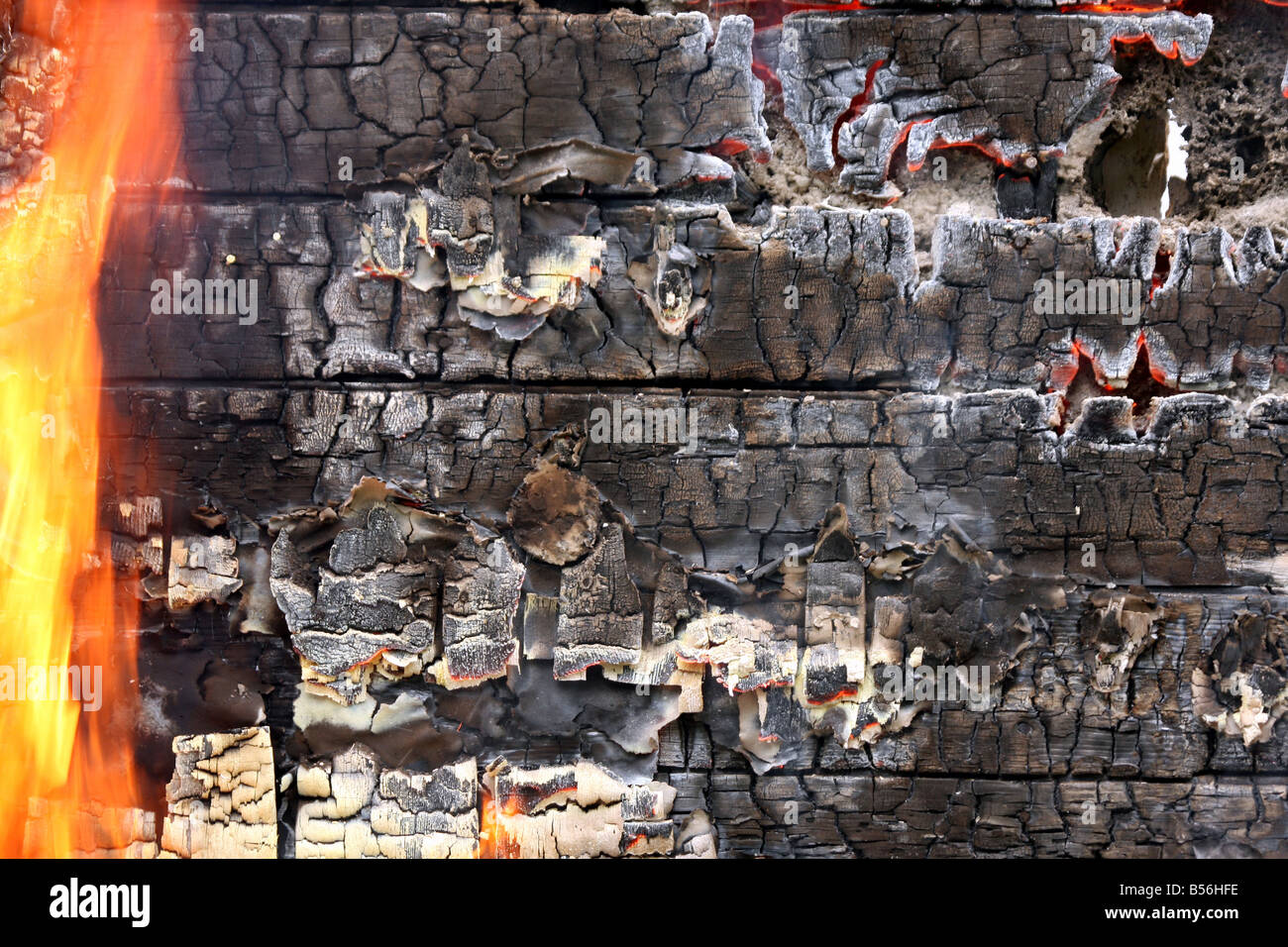An exterior wall of a house on fire Stock Photo - Alamy