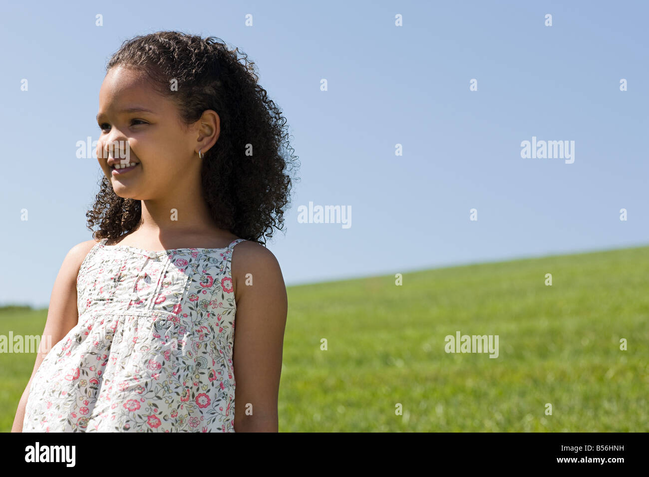Girl in a field Stock Photo - Alamy