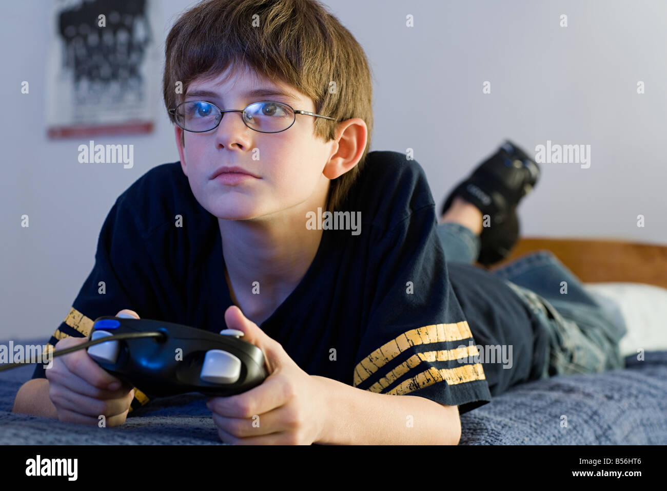 Boy playing a video game Stock Photo - Alamy