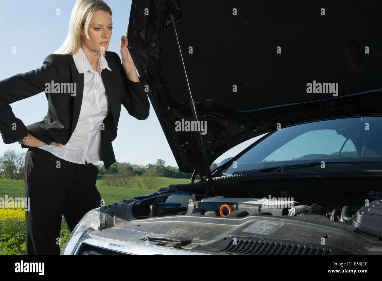 A woman having automobile trouble Stock Photo - Alamy