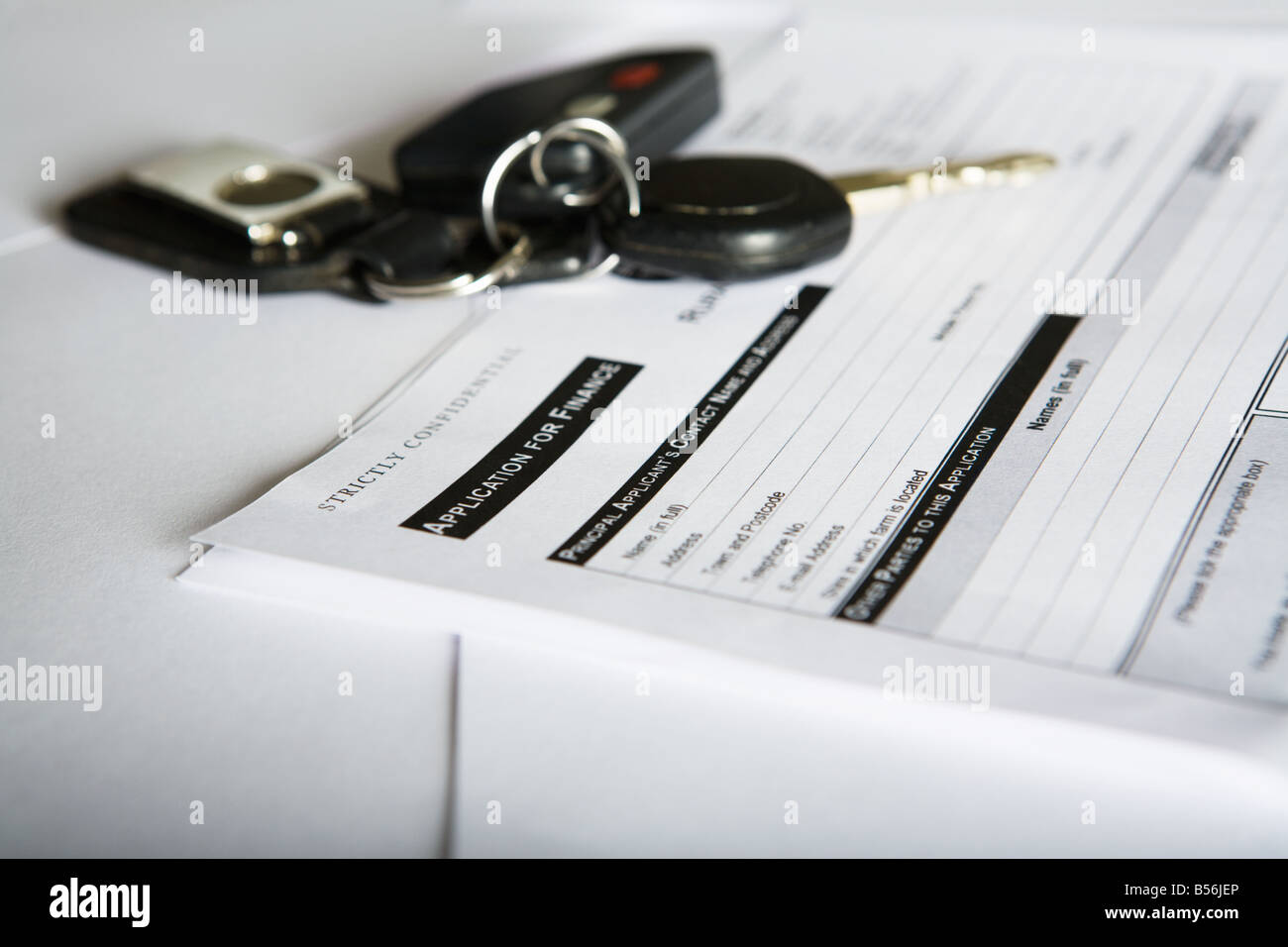 Car keys and an application form Stock Photo - Alamy