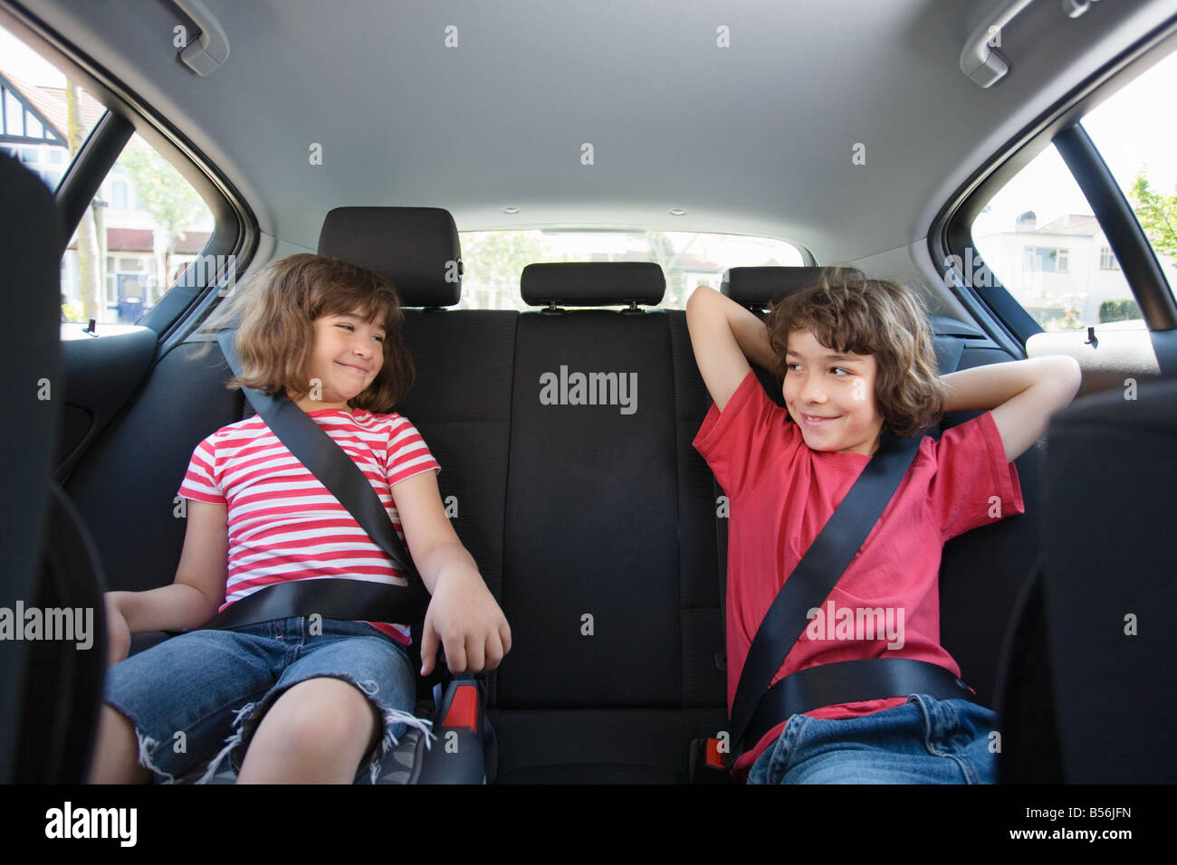Children sat in a car Stock Photo - Alamy