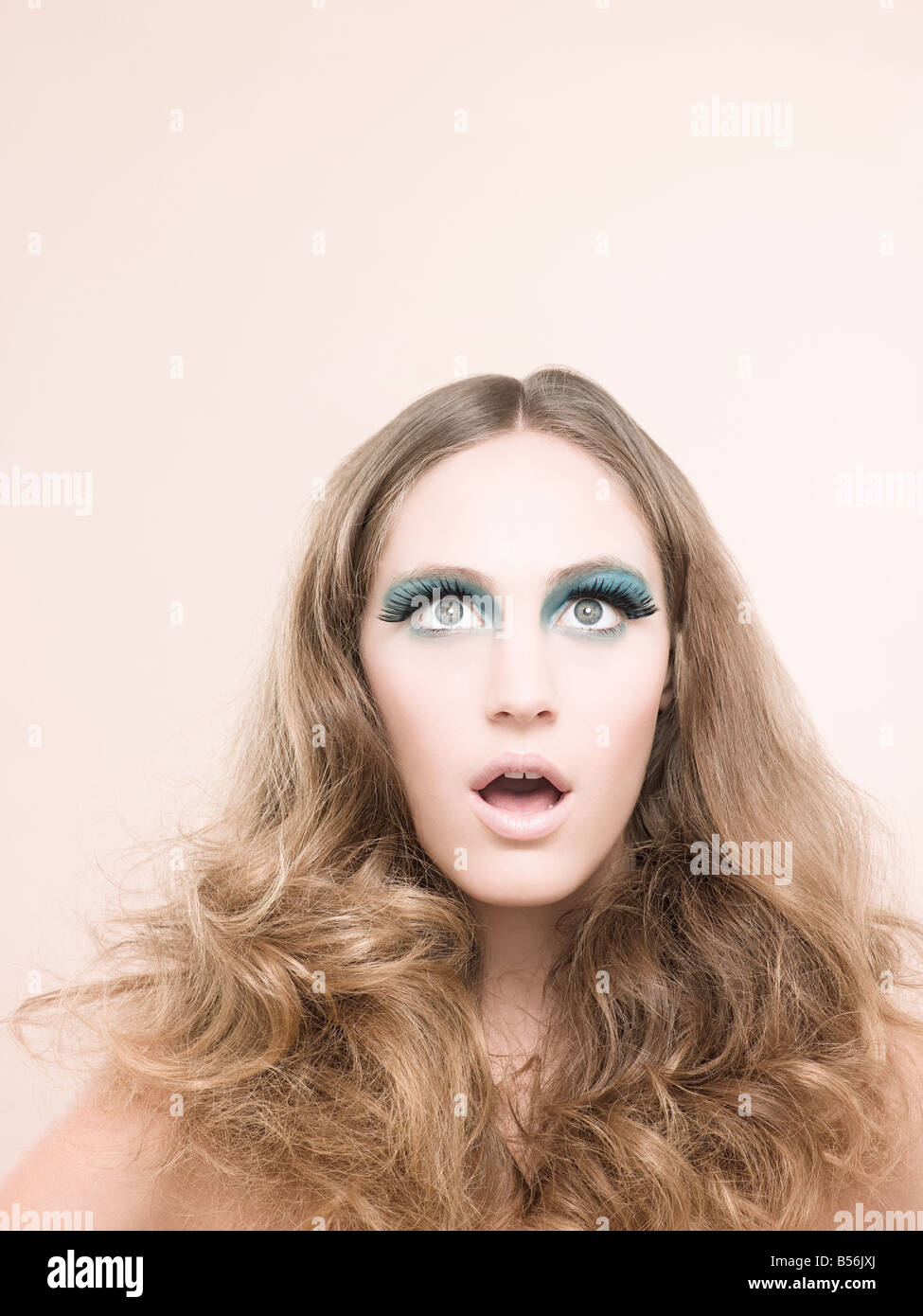 A young woman wearing false eyelashes Stock Photo - Alamy