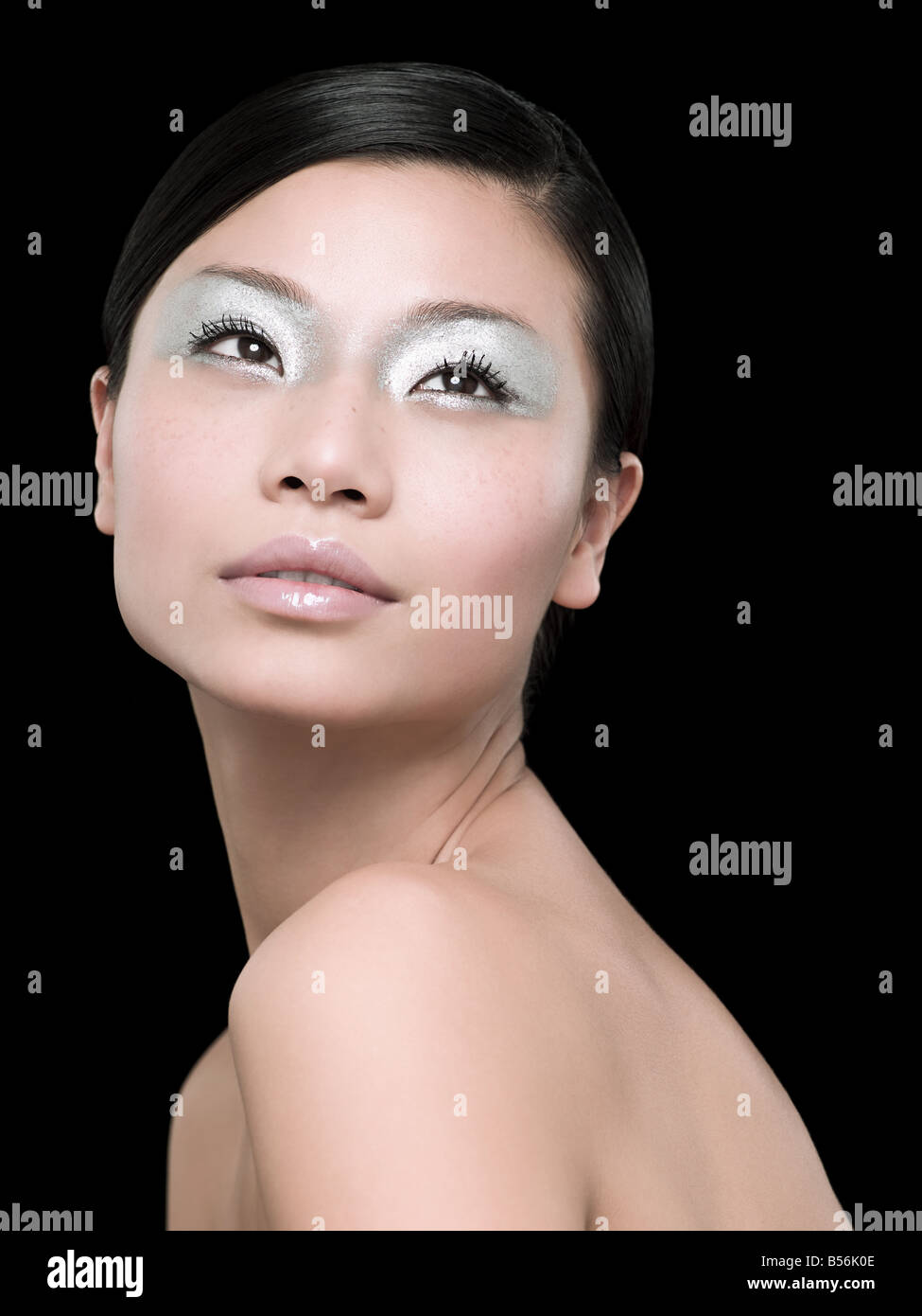 A young woman wearing silver eyeshadow Stock Photo - Alamy