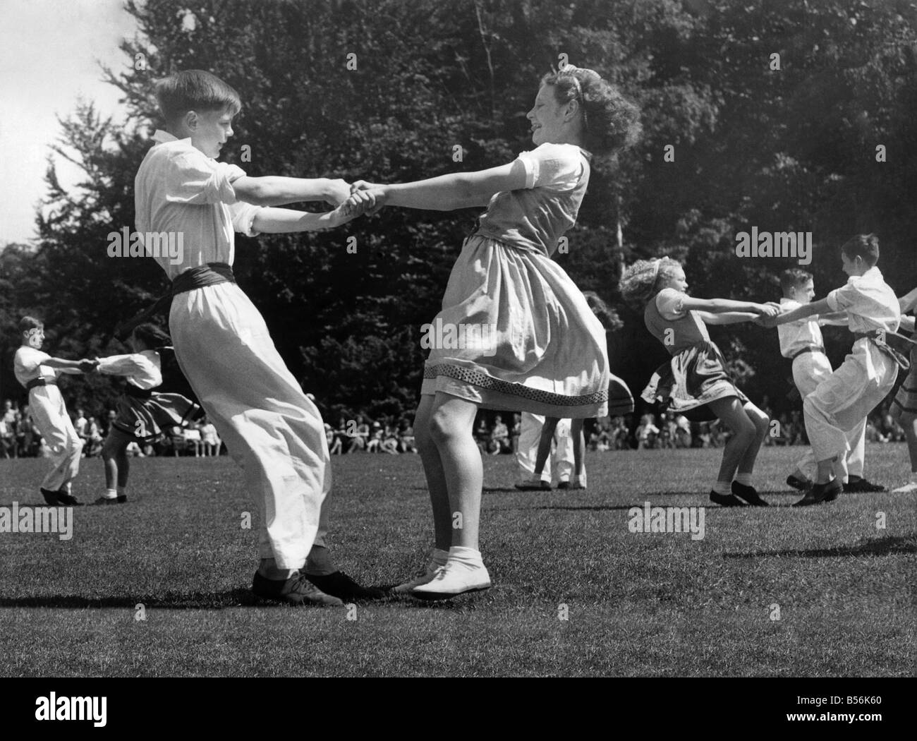 Some of the younger end of the school-children, country-dancing at ...