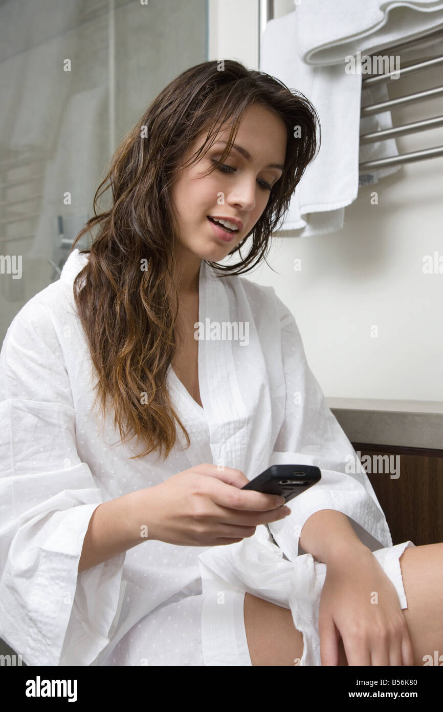 A woman using a cell phone Stock Photo - Alamy