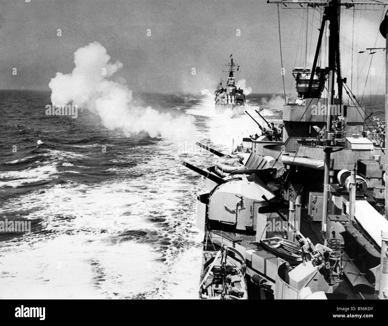 Battleship firing hi-res stock photography and images - Alamy