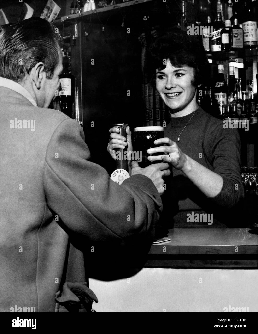 21 year old barmaid Joyce McKnight serving a customer at the Black Bull ...