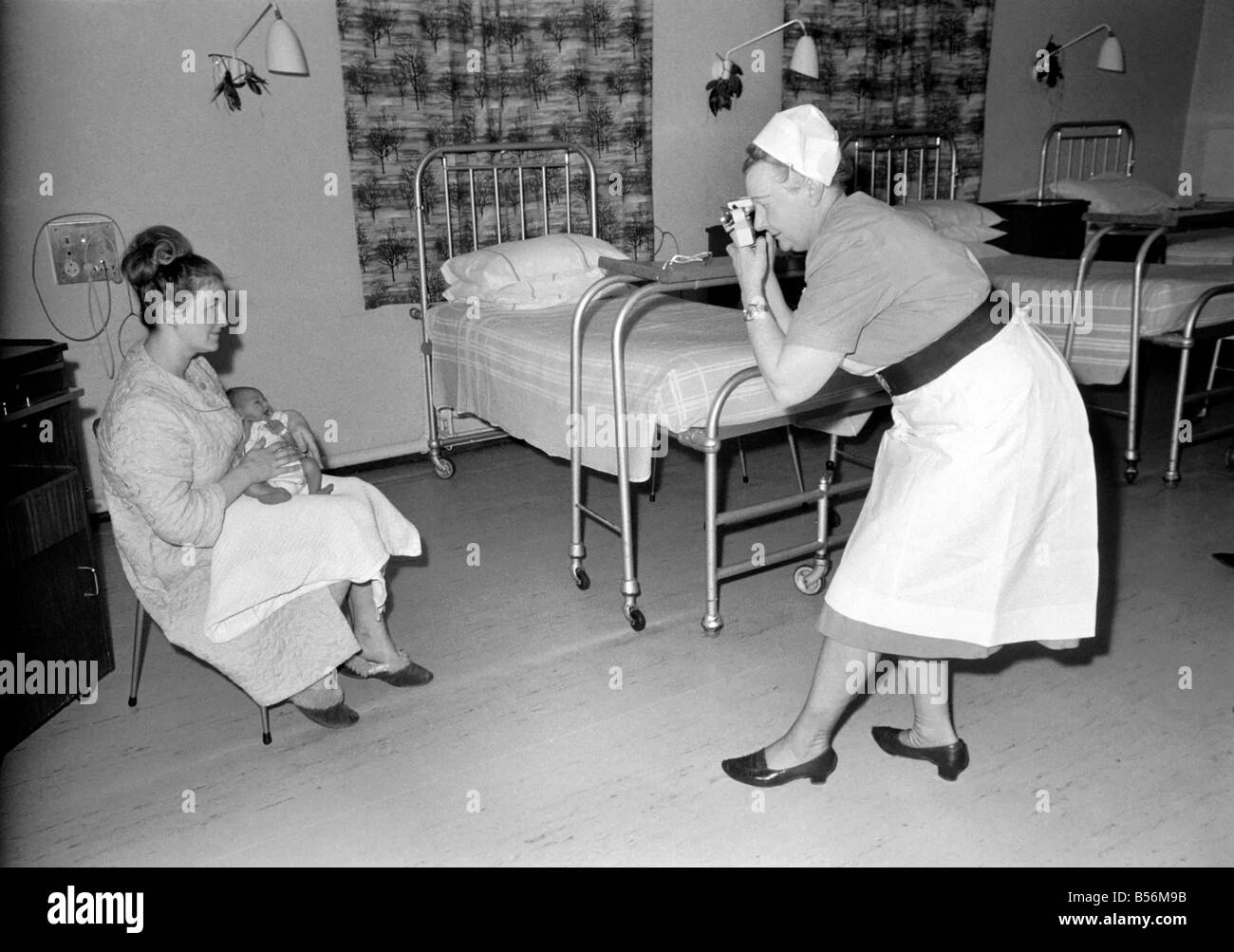 Midwife May Guthrie-Lacy photographs the 287th baby which she has ...