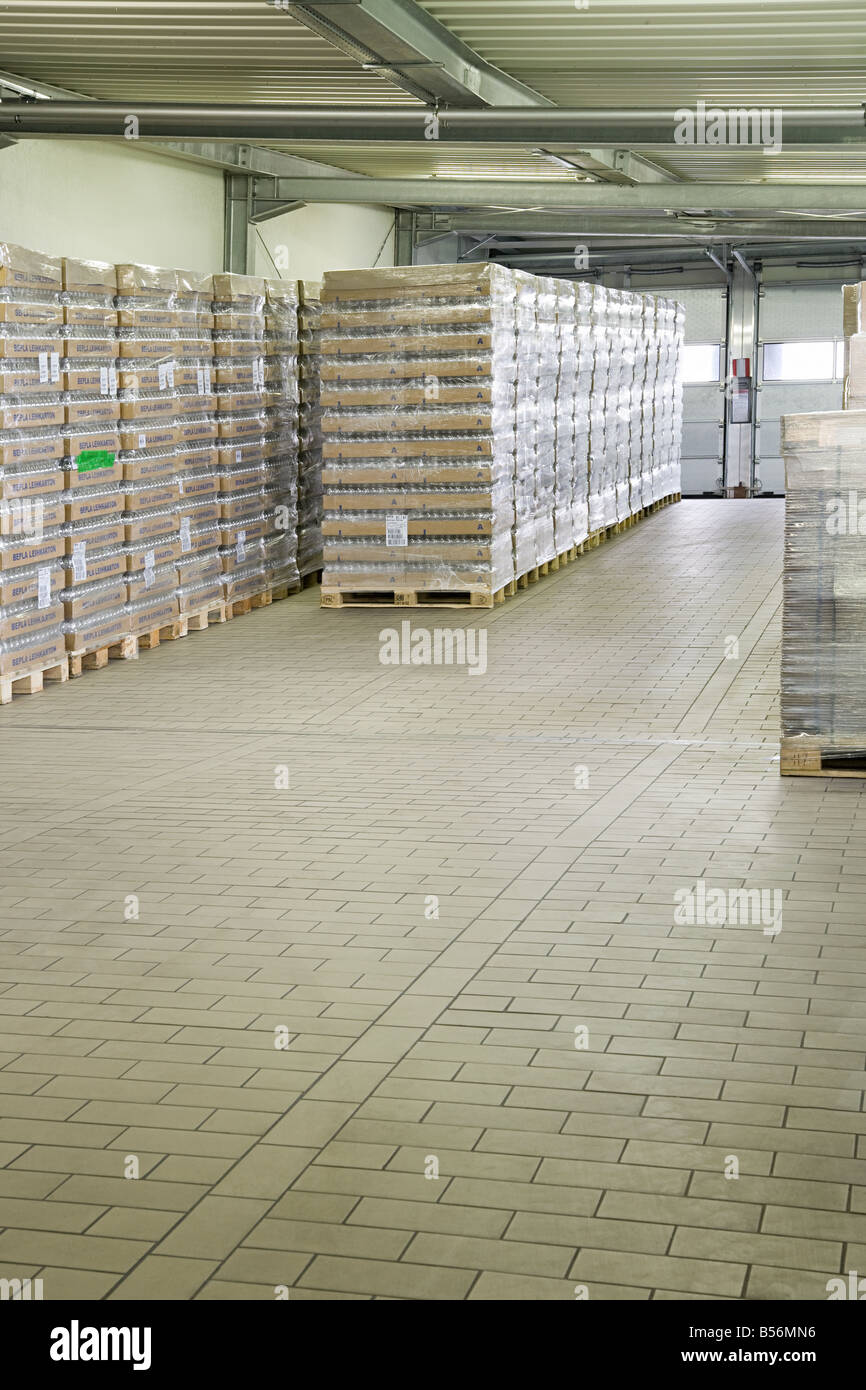 Pallets of stock in a warehouse Stock Photo - Alamy