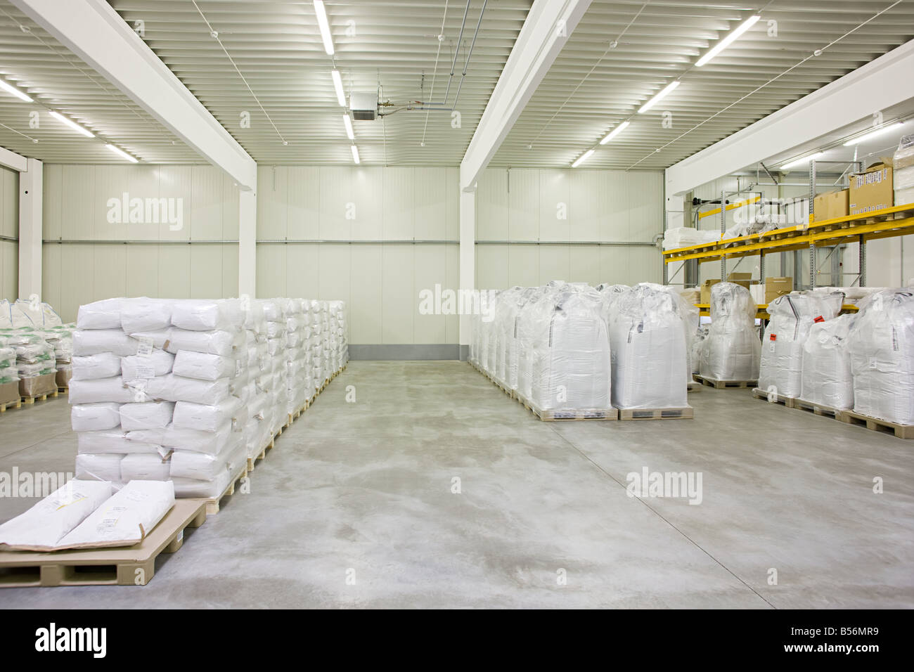 Pallets of stock in a warehouse Stock Photo - Alamy