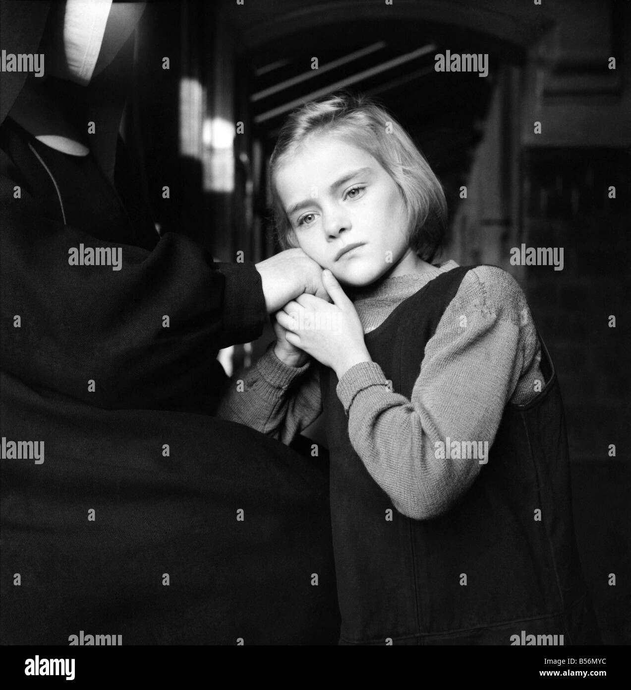 Children. Orphan girl looking out of window. December 1953 D7311-004 ...
