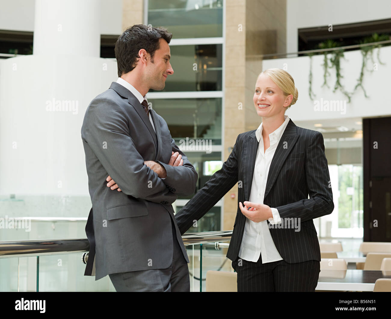 Business people talking Stock Photo - Alamy