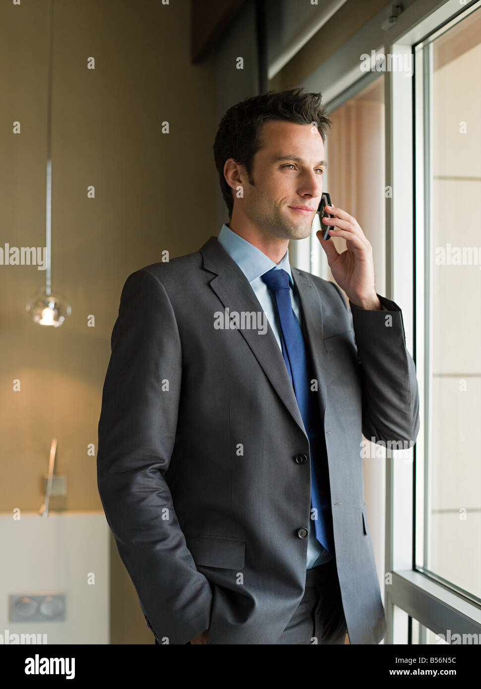 A businessman using a cell phone Stock Photo - Alamy