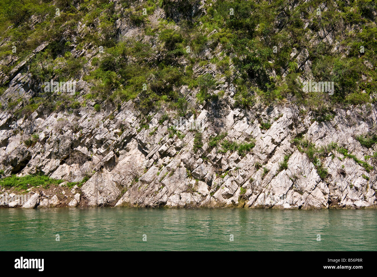 Limestone rock strata tilted at 45 degrees angle alongside the Daning ...