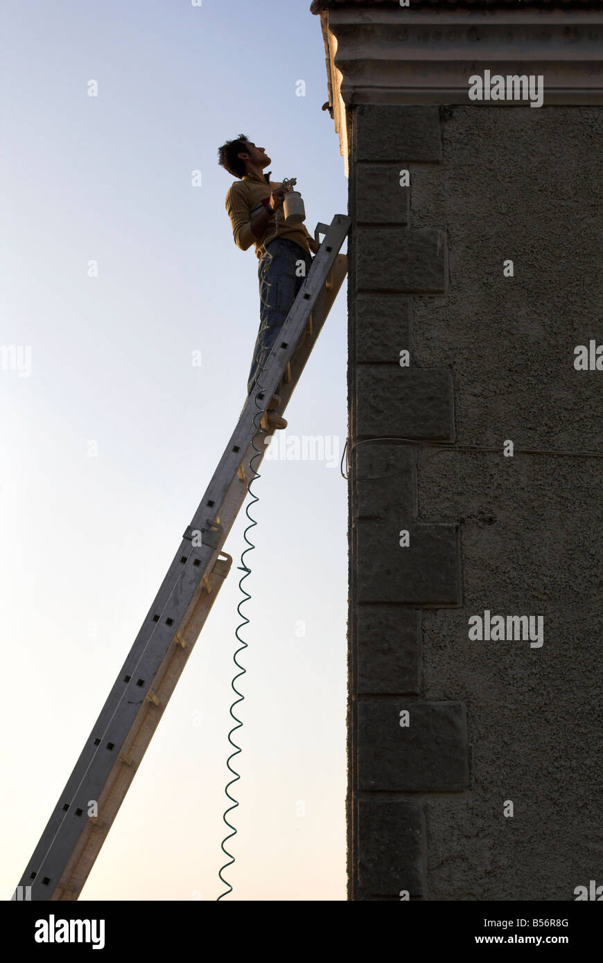 Tall ladder climbing hi-res stock photography and images - Alamy