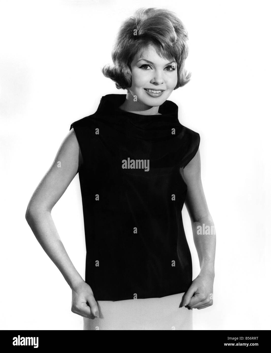 Model Liz Duke wearing sleveeless top with polo neck. February 1962 ...