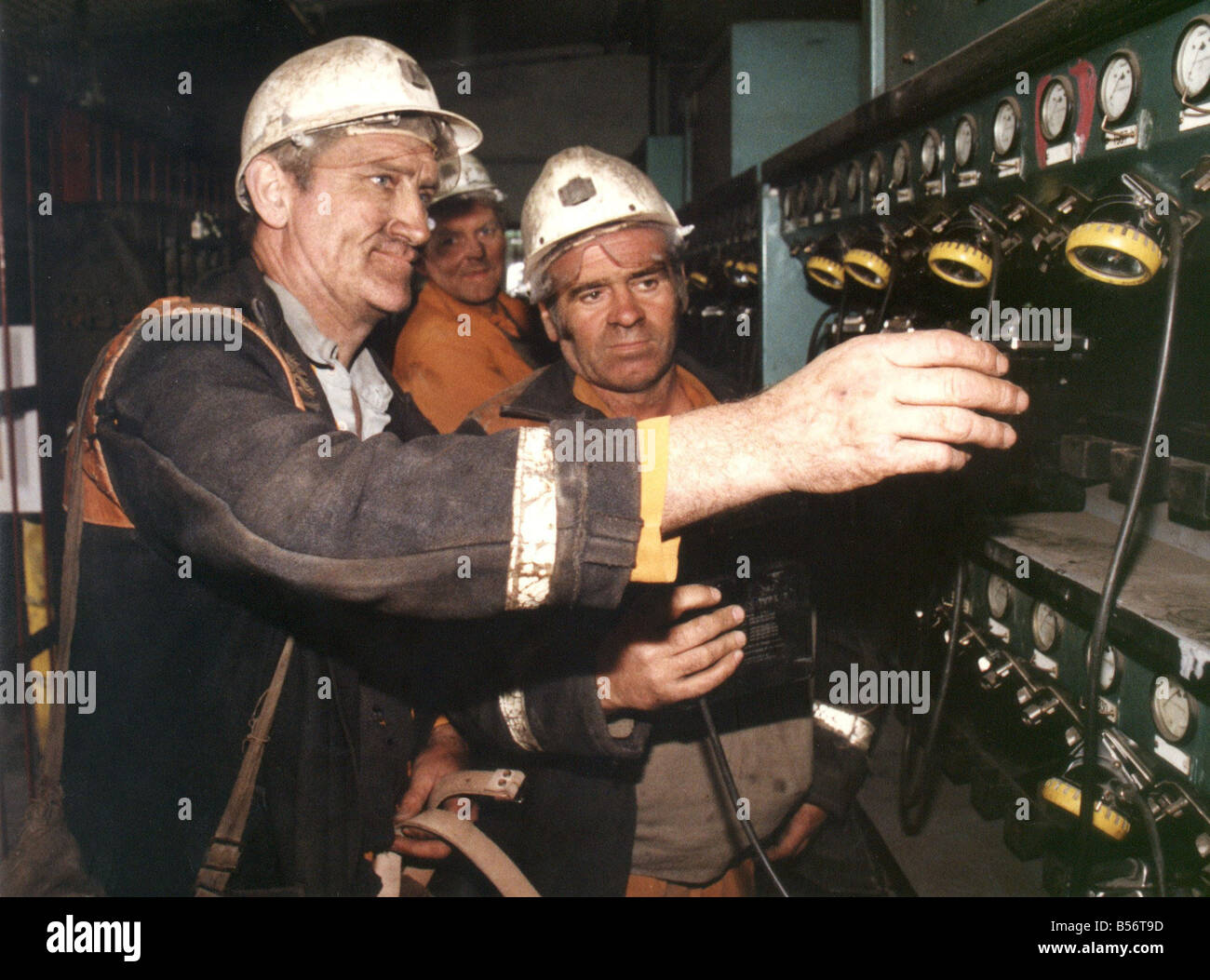 Miners Ron Oates left and Joe Olley hand in their lamps for the last ...