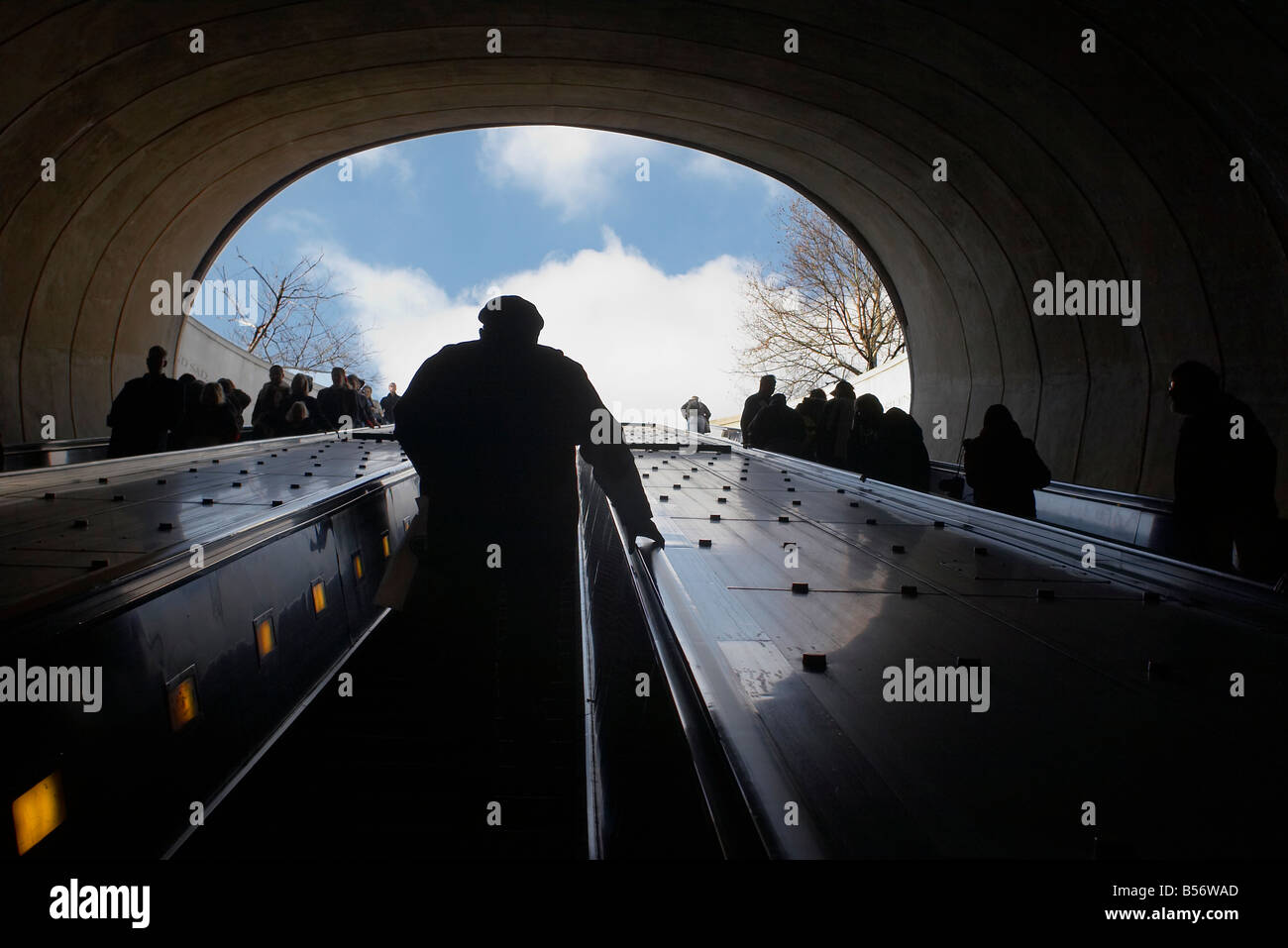 Passengers enter and exit the Metro system at the Dupont Circle station ...