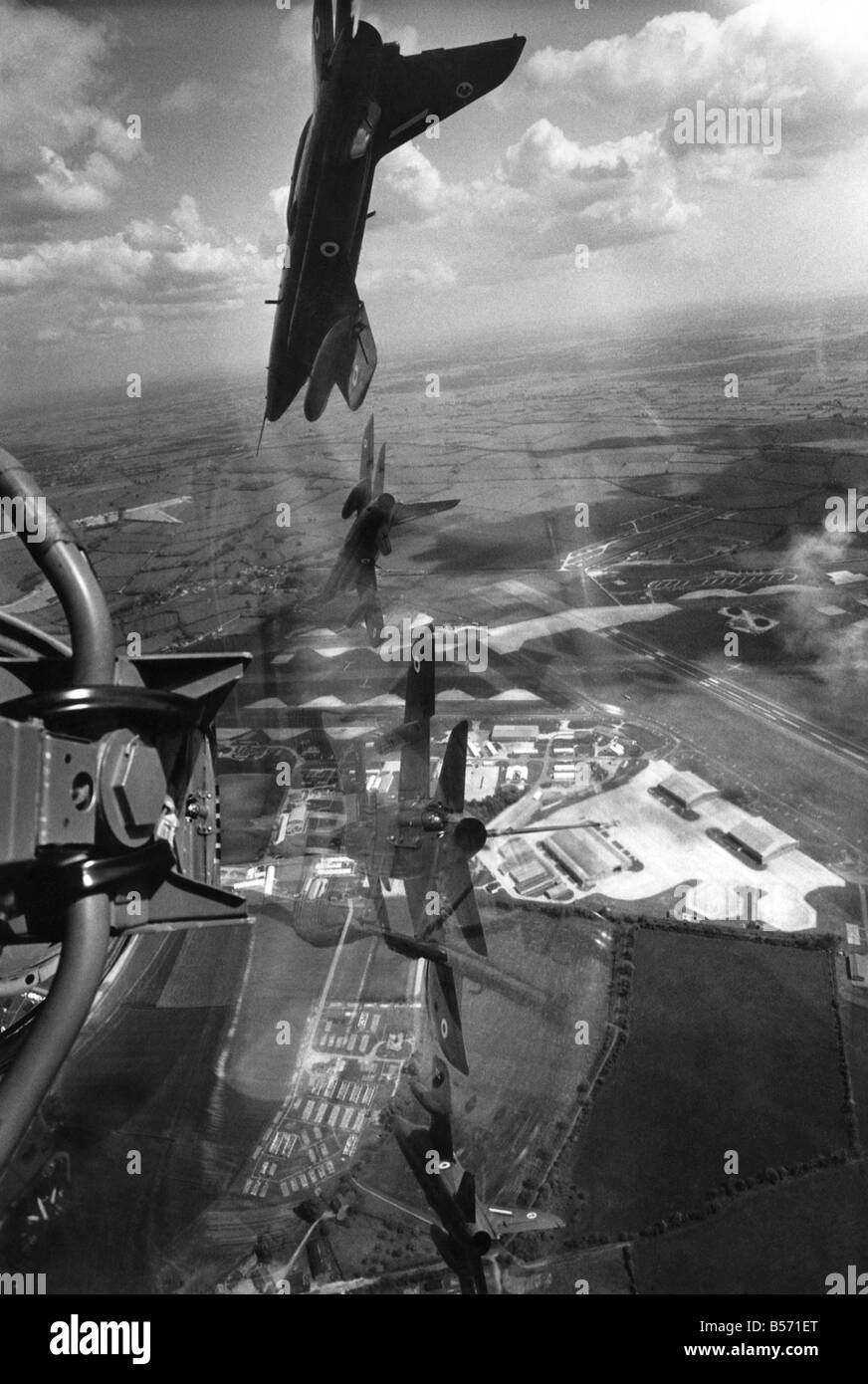 A Red Arrows display;Gnat trainers flying in formation over their base ...