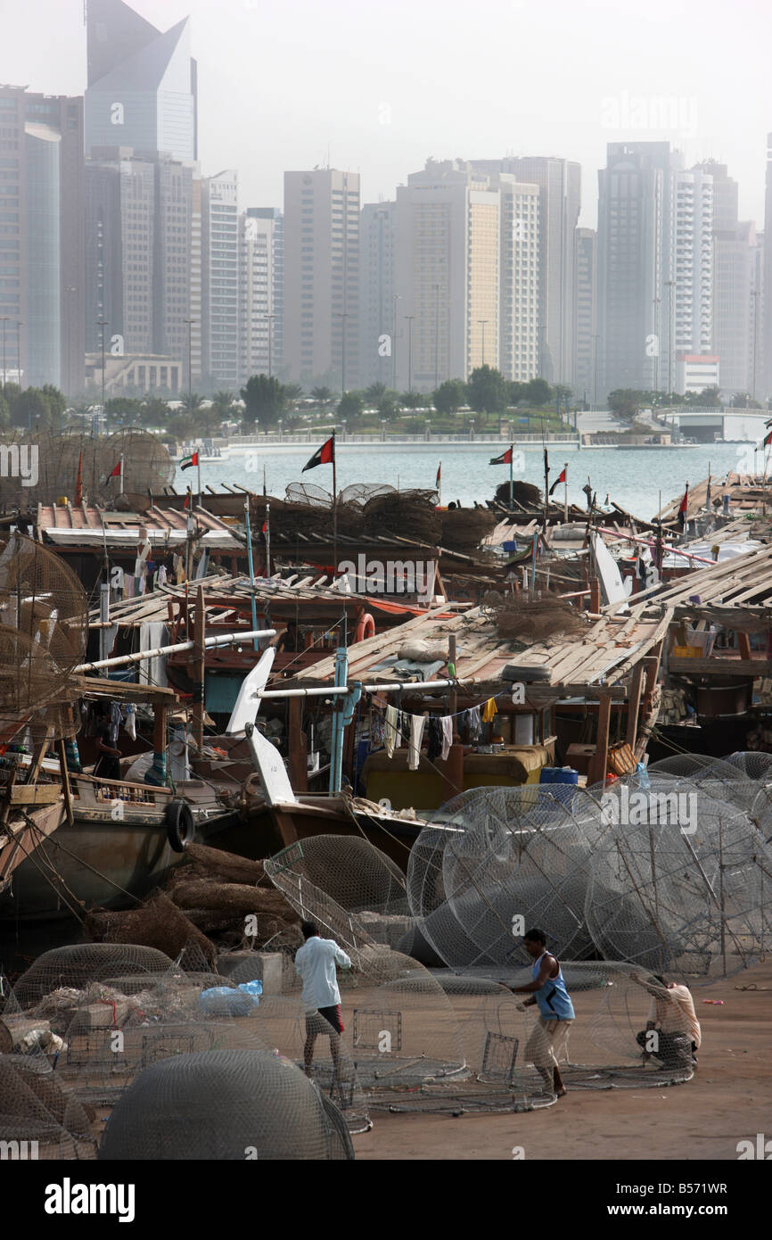 UAE Abu Dhabi Skyline at the corniche and fishing harbour Stock Photo ...