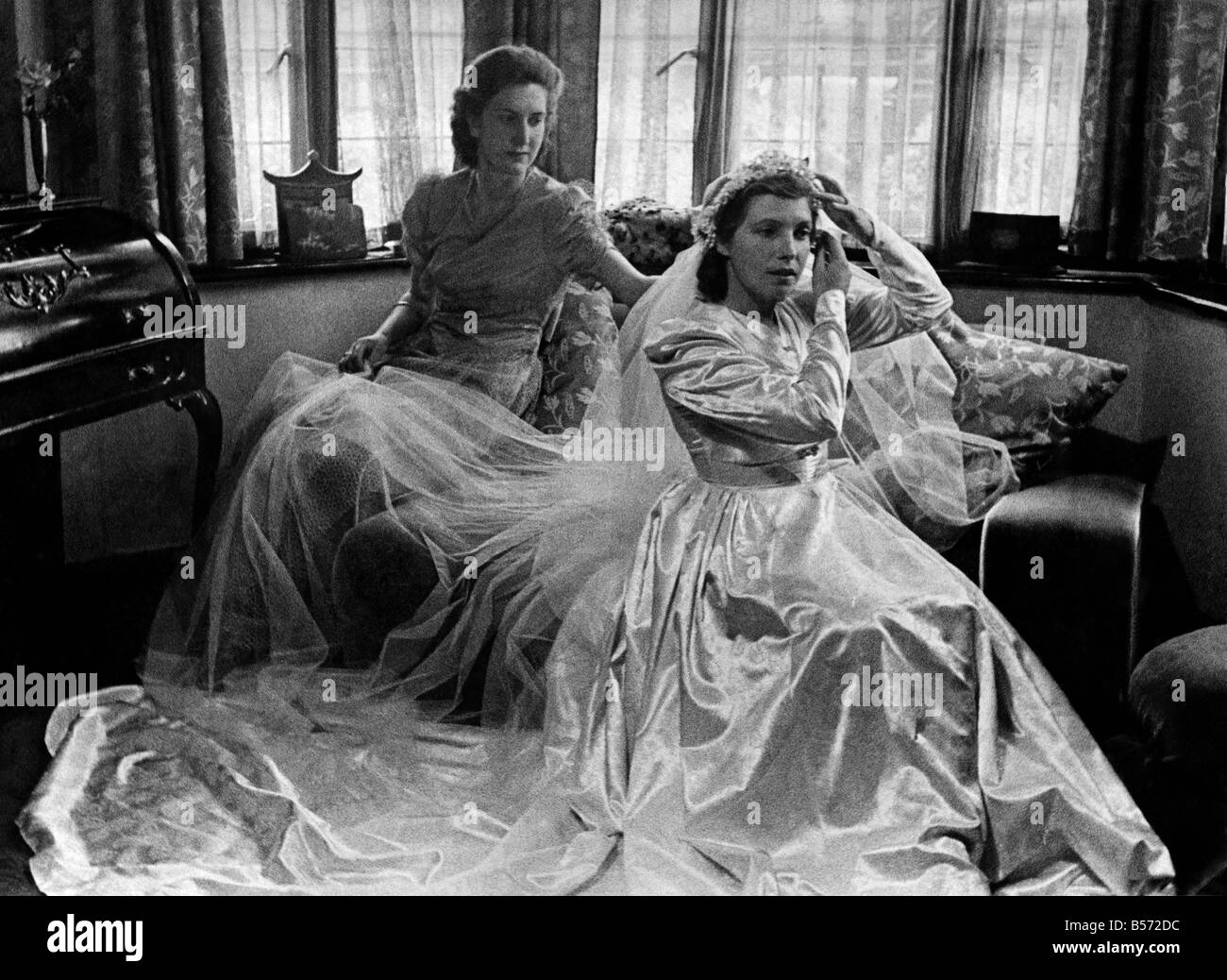 World War II Women: Bride dressing for her wedding. October 1943 ...