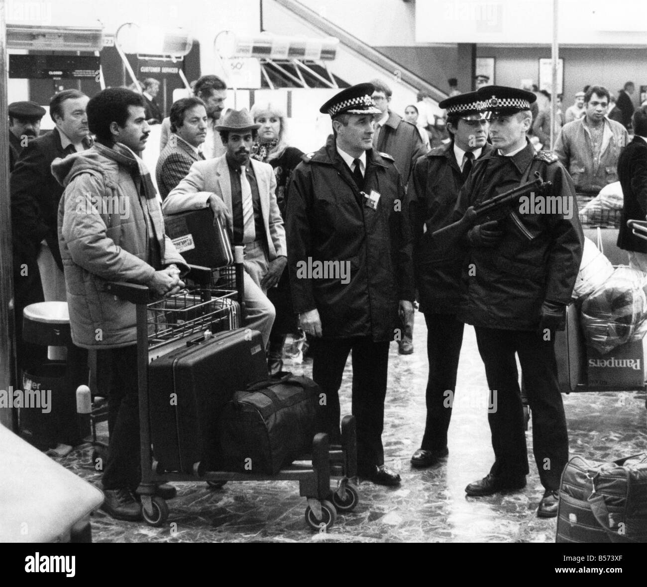 Gun-Row Heathrow: This was the menacing scene which greeting travellers ...