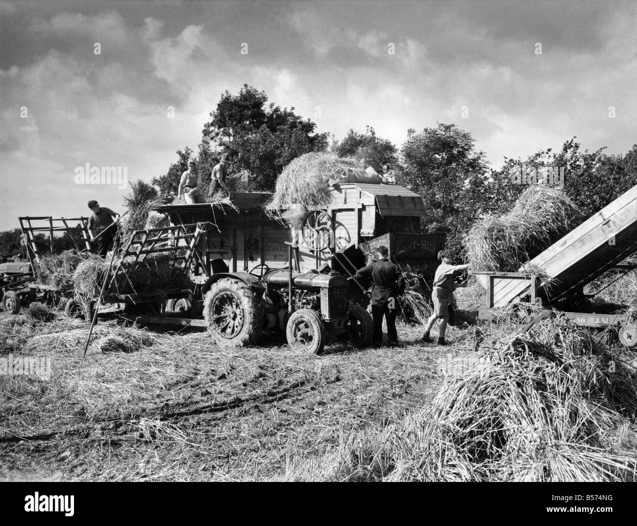 Farmers harvest crop in Black and White Stock Photos & Images - Alamy