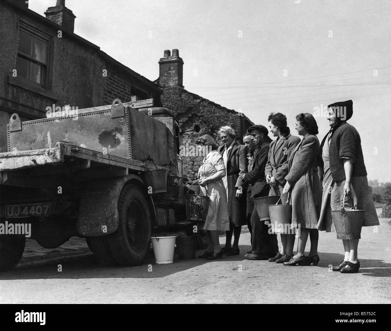 The housewives of Tottington queue up for their daily ration' of water ...