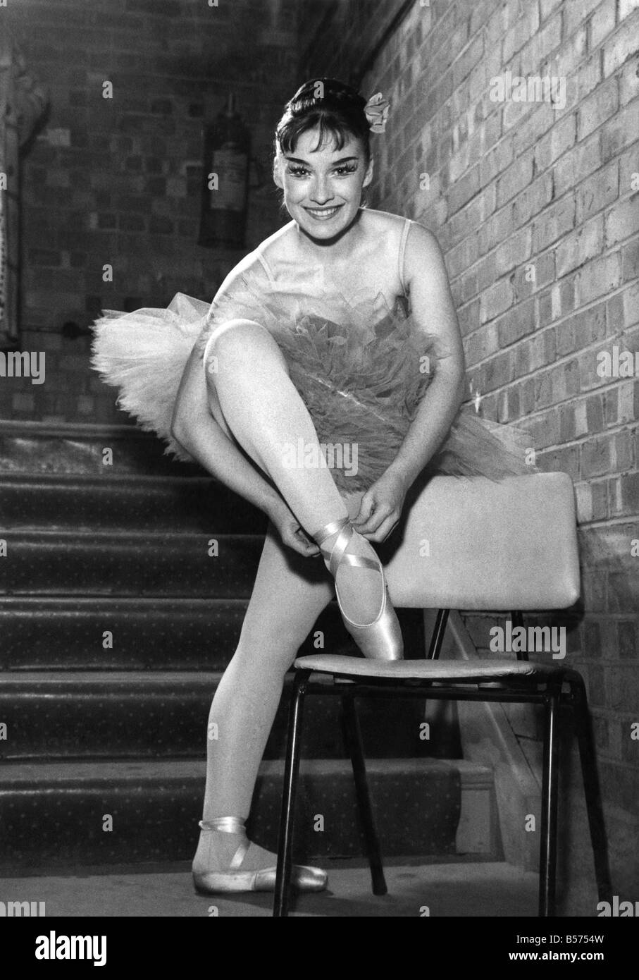 Ballerina Anna Price seen here checking the bindings on her shoes ...