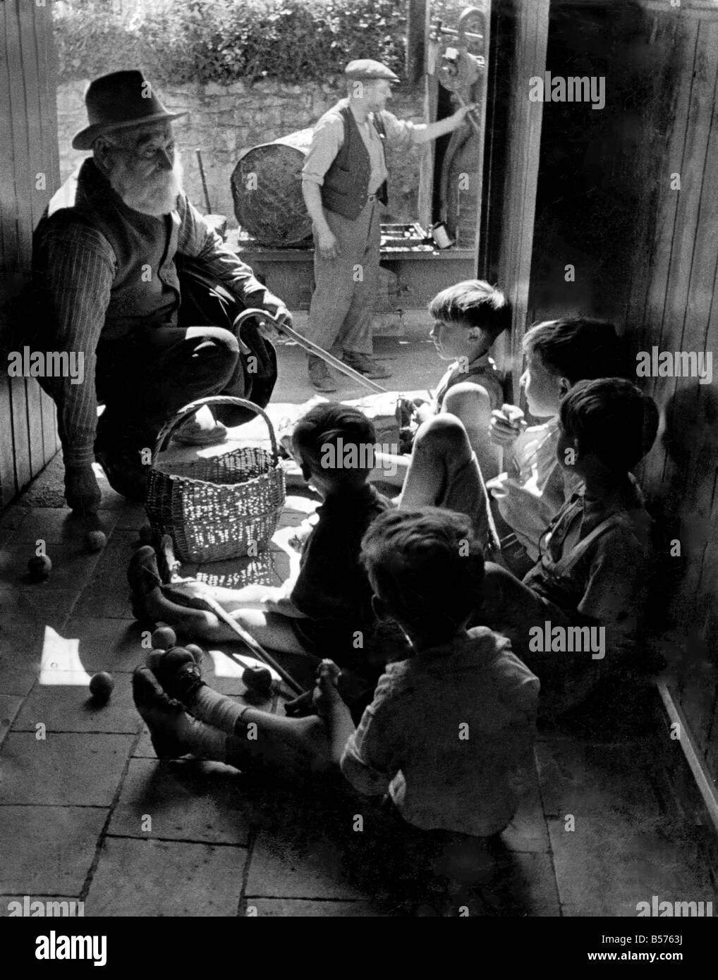 A scene in the doorway of the 300 year old Ship Inn, Combwich Somerset ...