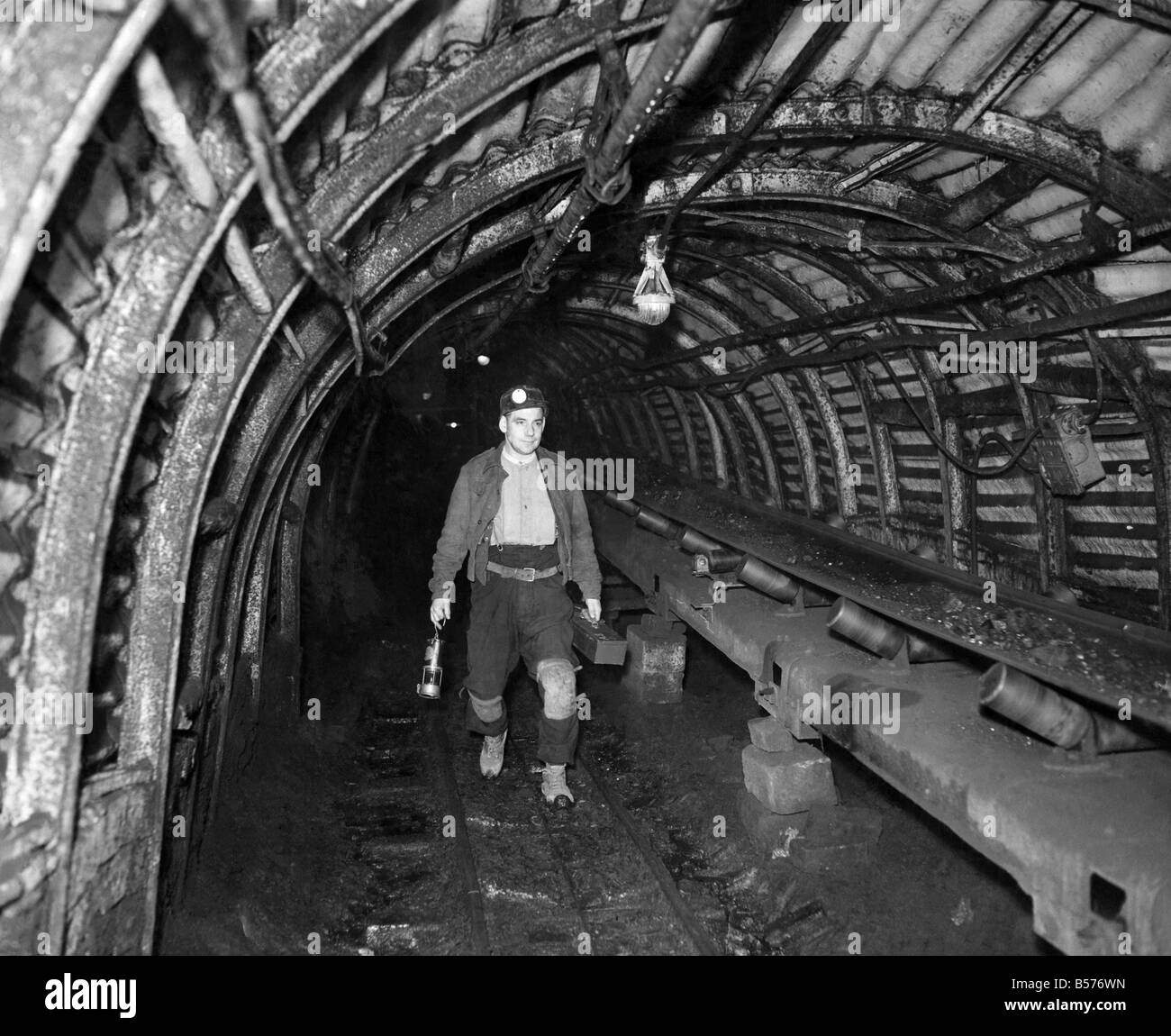 Cliviger colliery, near Burnley. Albert Smith a Deputy walks the mile ...