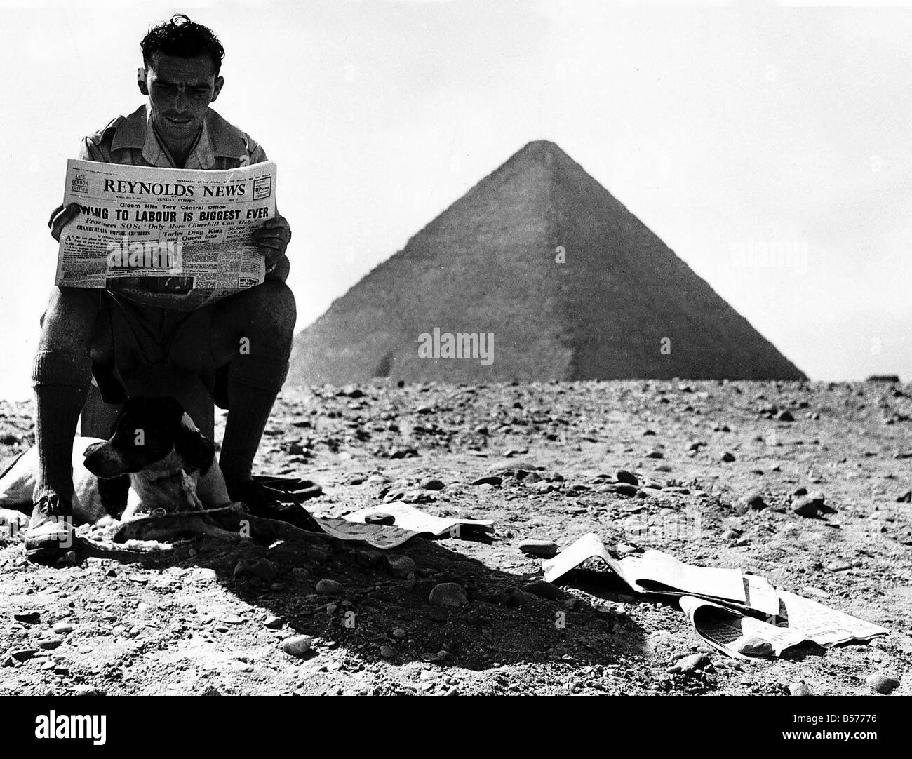 WW2 Corporal E Hopwood of Acton Wrexham reading the paper after casting ...
