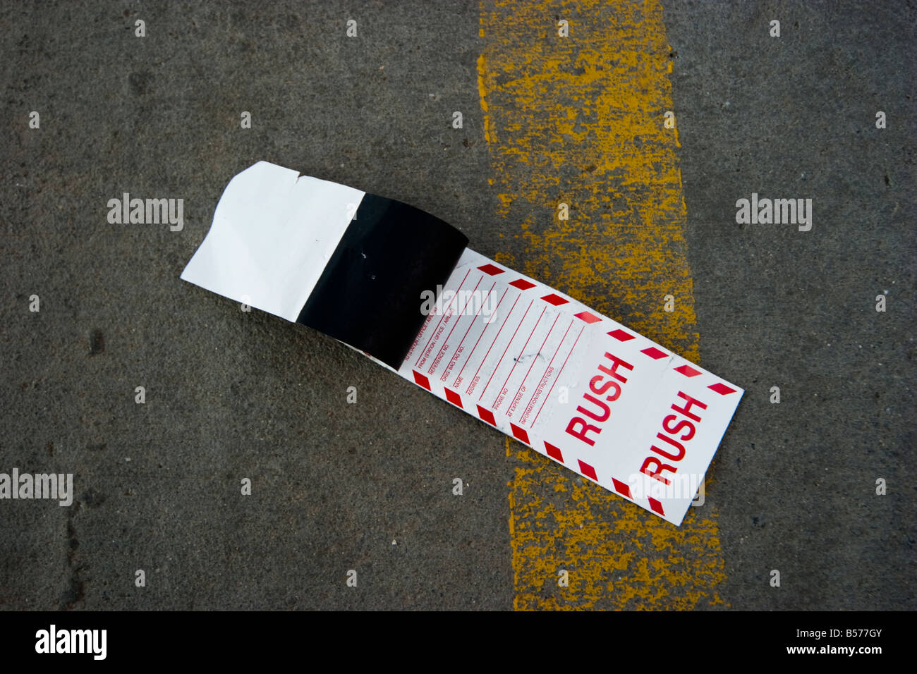 Discarded mailing label with RUSH printed on it Stock Photo - Alamy