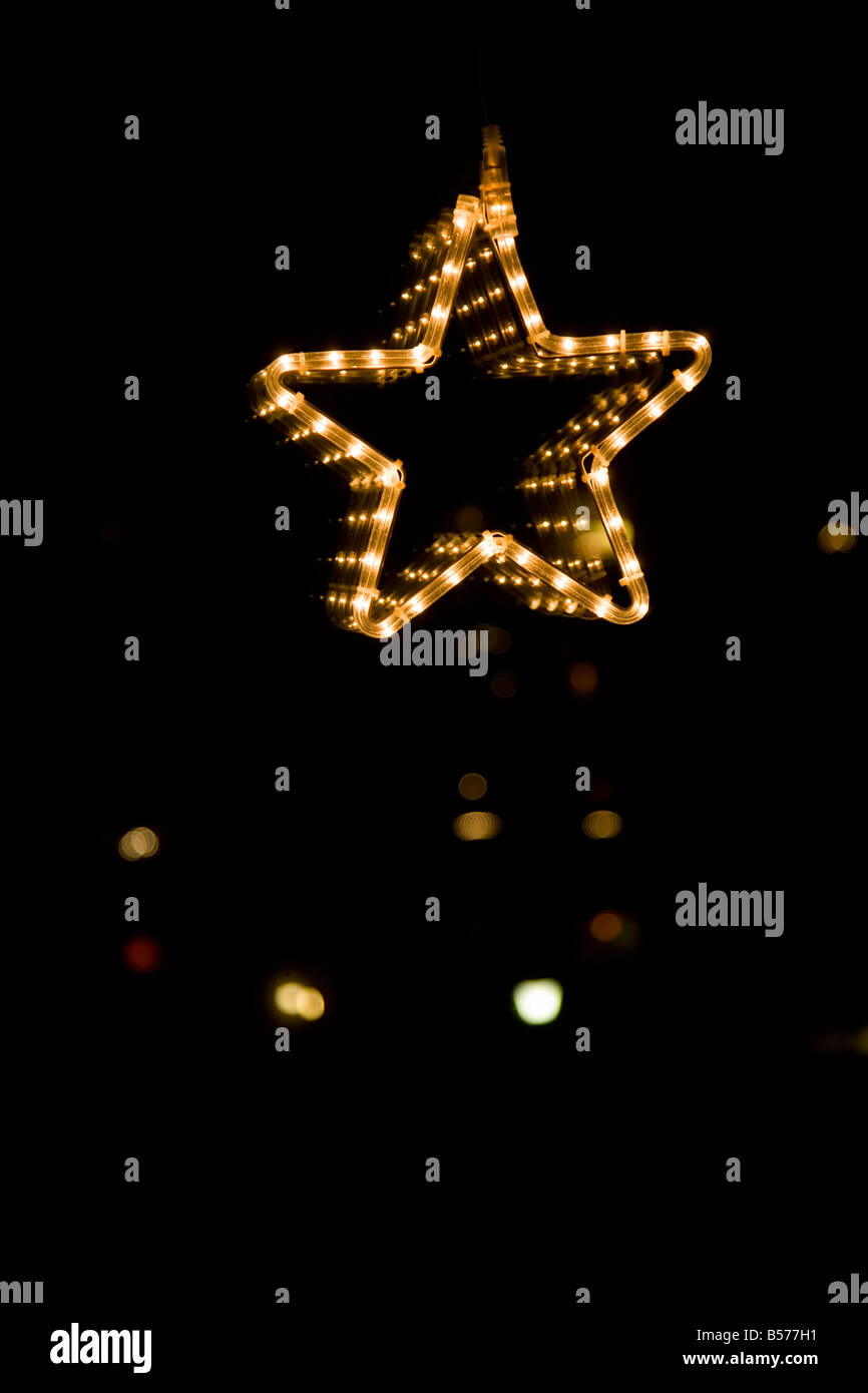An LED star reflecting in a window Stock Photo - Alamy
