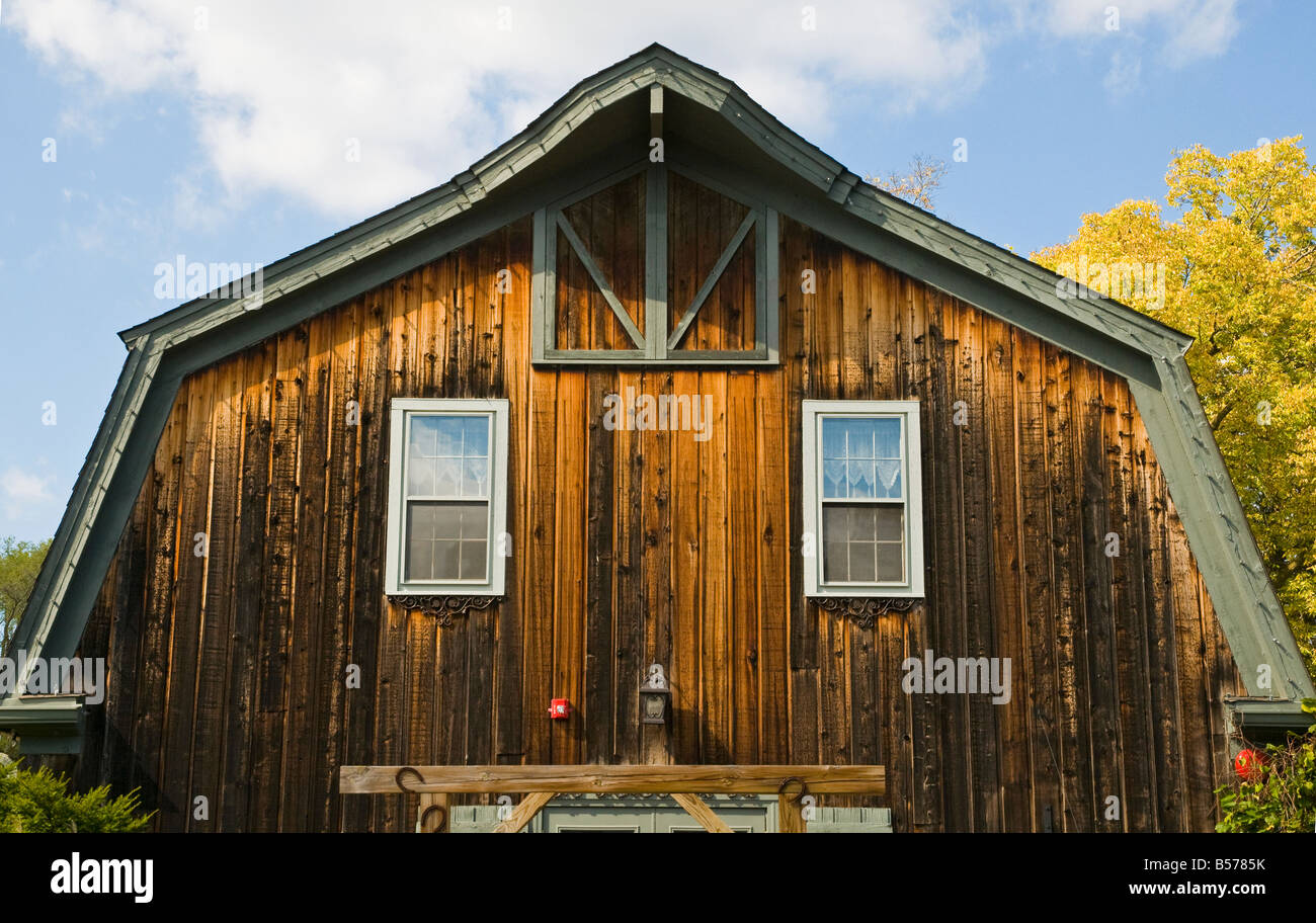 Gambled Roof with Natural Wood Siding on Converted Barn Stock Photo - Alamy