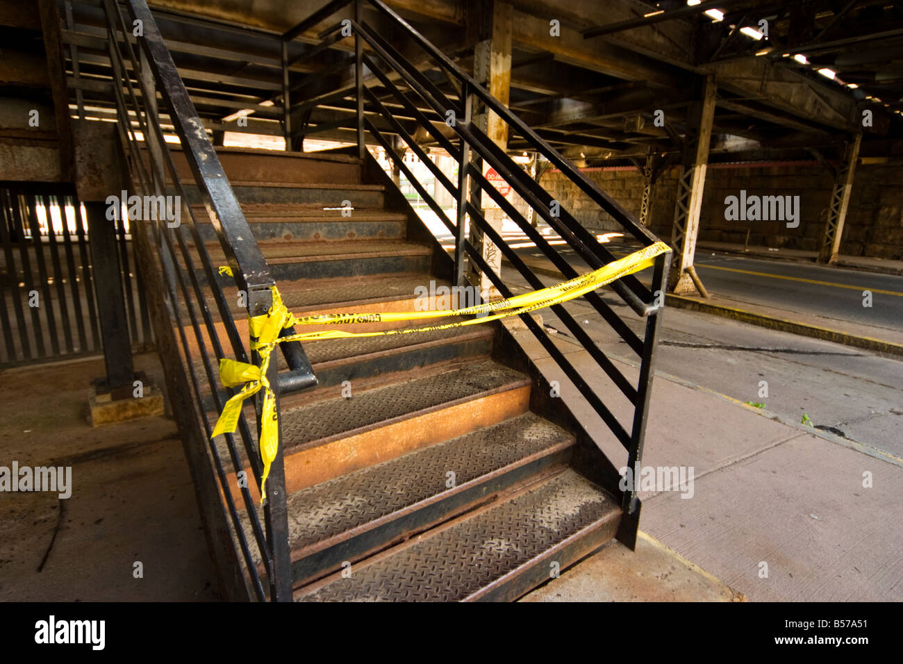Outdoor stairs with yellow tape blocking their use Stock Photo - Alamy