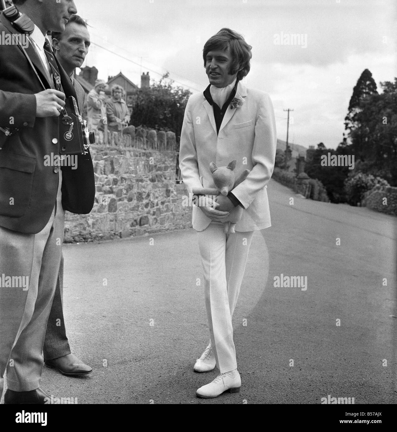 Mike McCartney's Wedding. Mike McGear with his doll on his way to ...