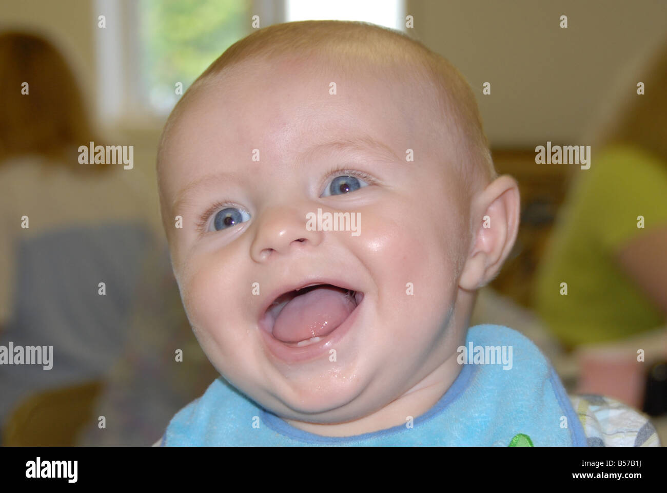 A baby laughing and smiling Stock Photo - Alamy