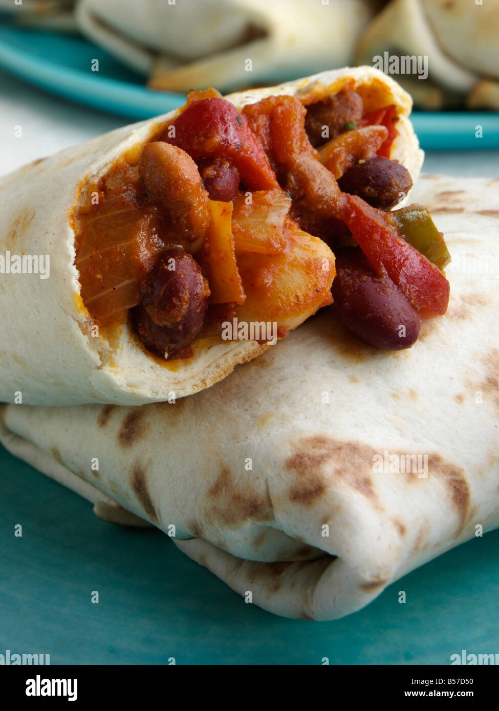 Mexican three bean chili burrito editorial food Stock Photo - Alamy