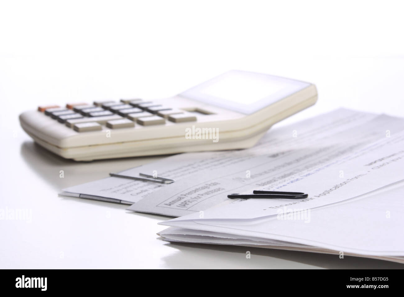 Documents and bills on desk with white background Stock Photo - Alamy