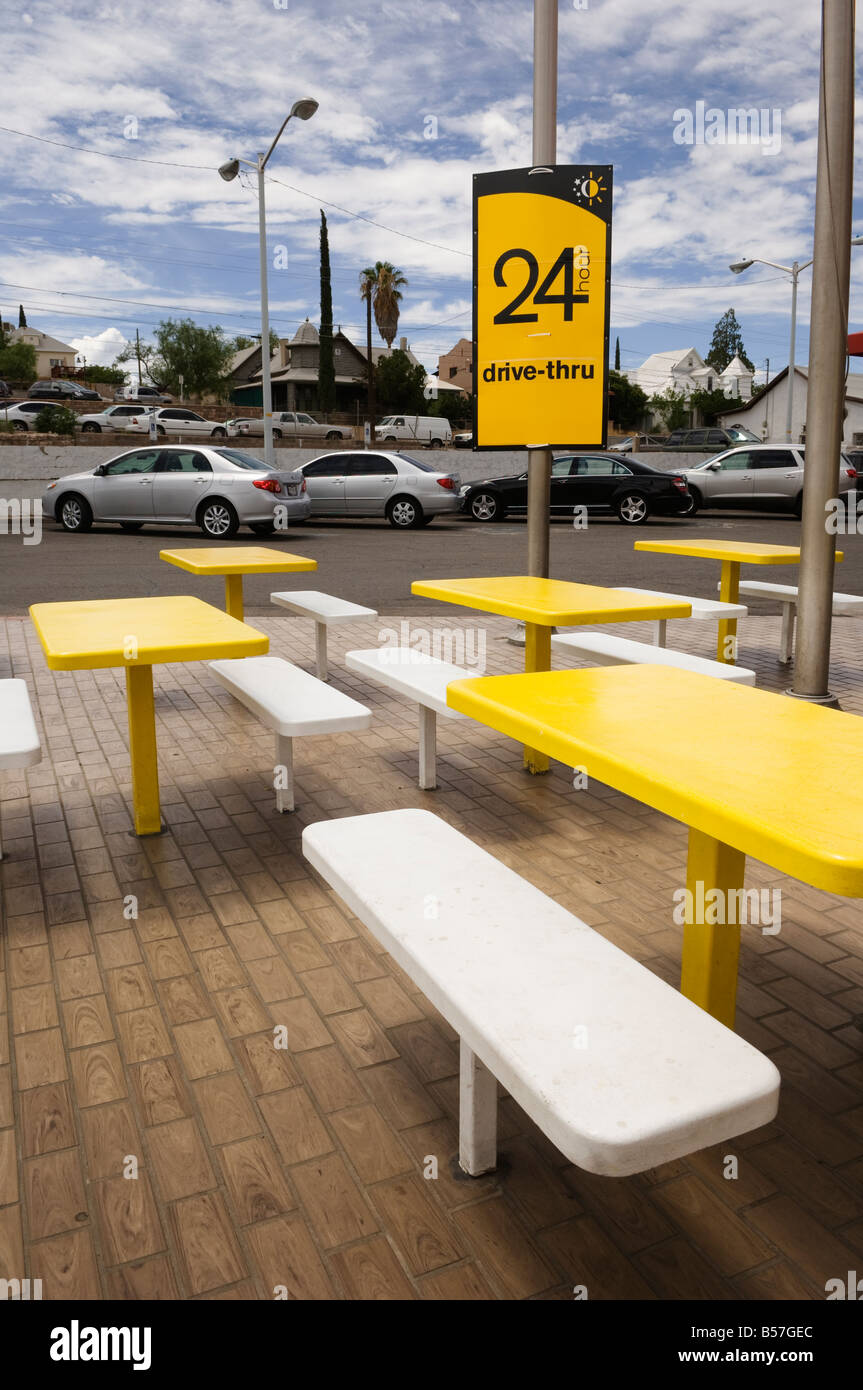 Empty benches at a fast food outlet Stock Photo - Alamy