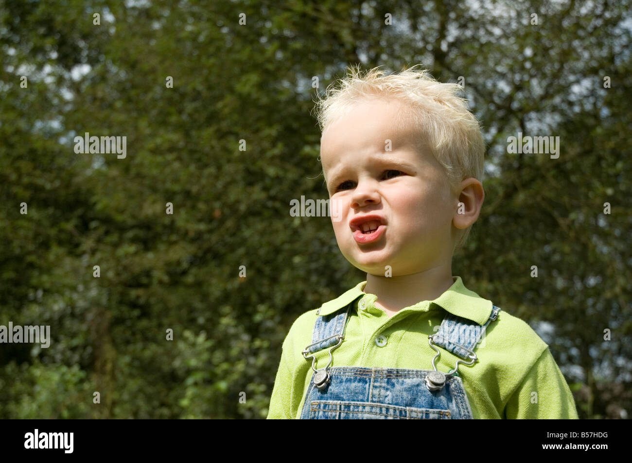 Boy looking surprised Stock Photo - Alamy
