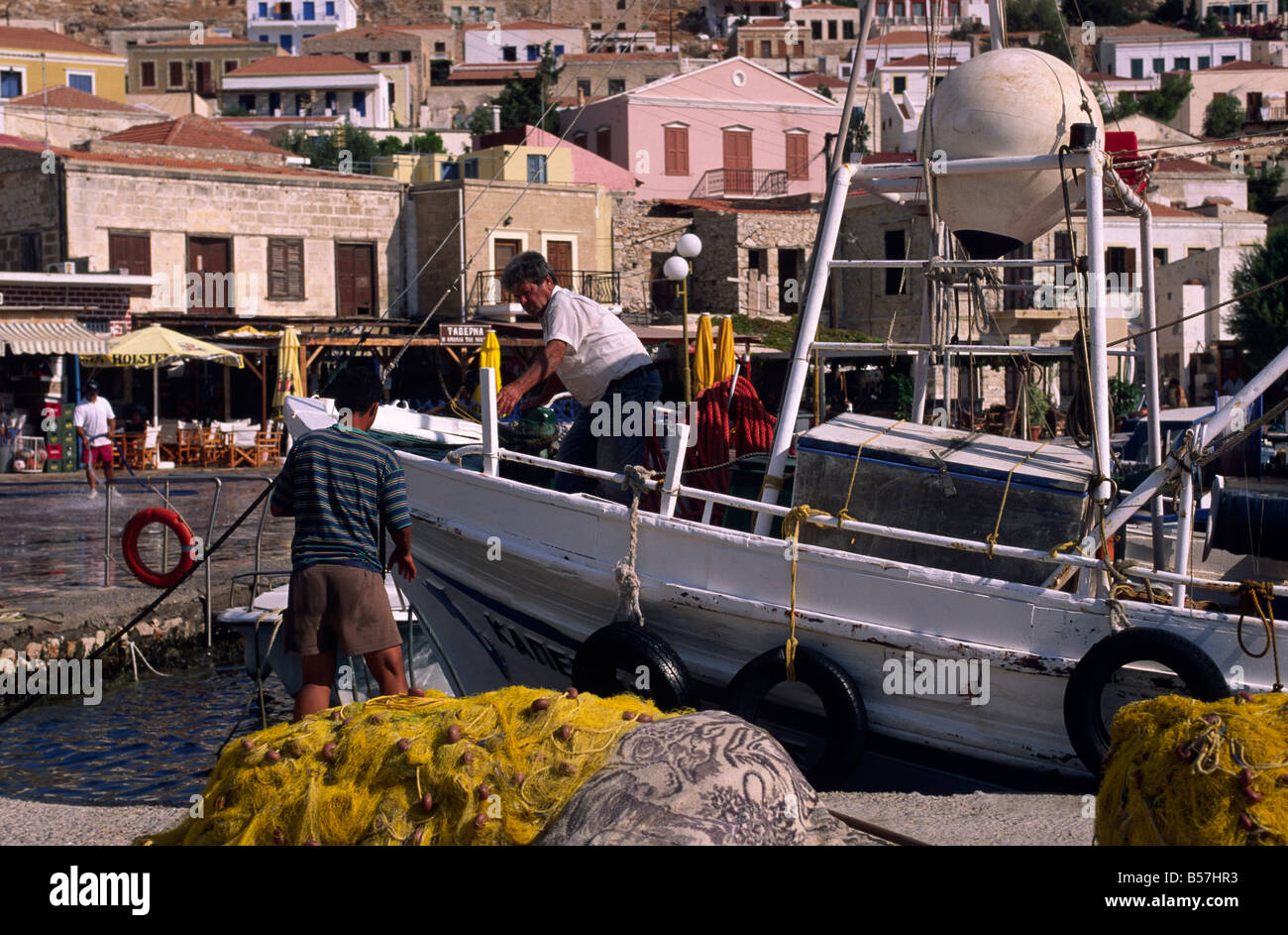 Greece, Dodecanese Islands, Halki, port, fishermen Stock Photo - Alamy